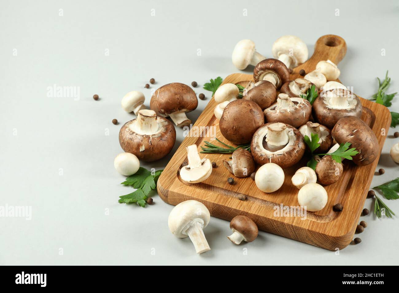 Concept of tasty food with champignon on white Stock Photo - Alamy