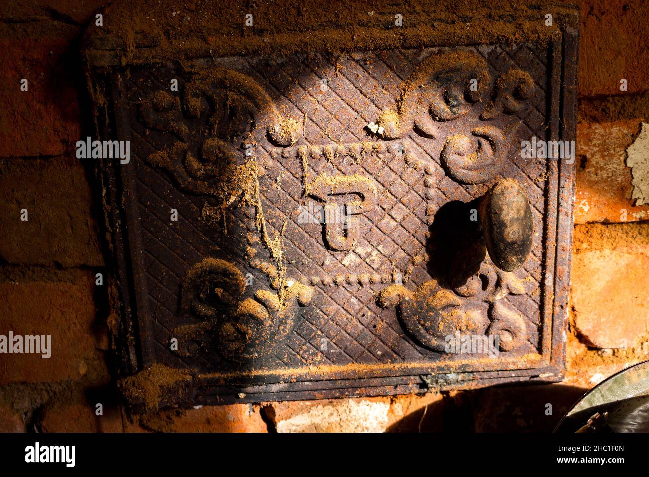 Cast iron door in an old rustic stove close up Stock Photo - Alamy