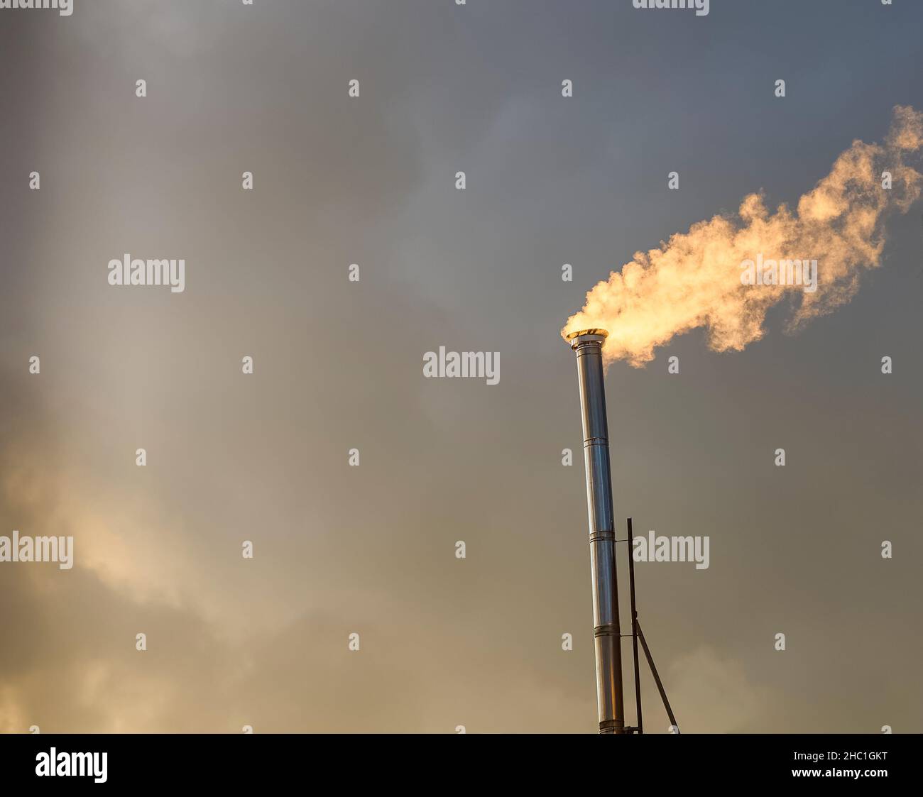 Smoke rising from stainless steel industrial chimney Stock Photo - Alamy