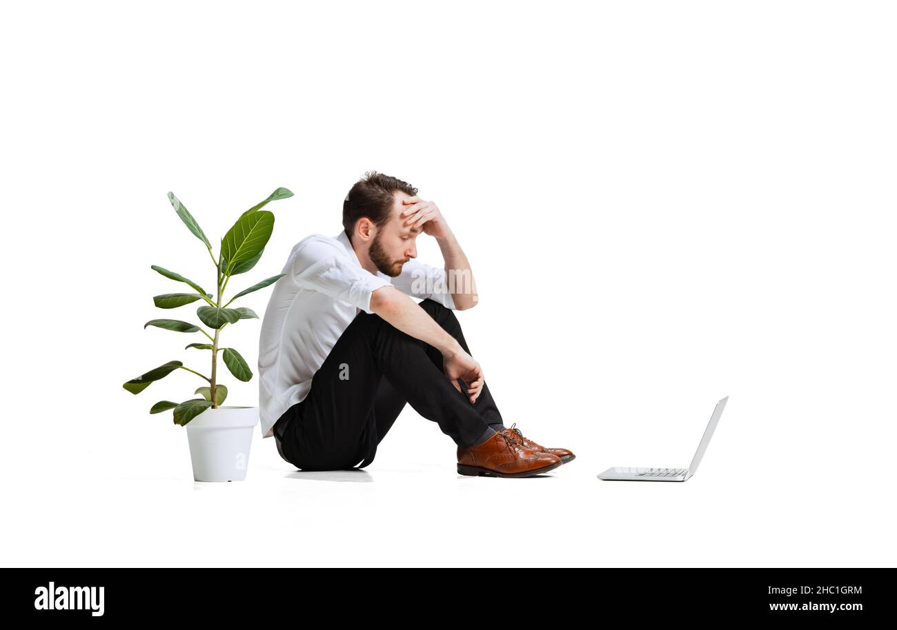 Full-length portrait of thoughtful man, employee thinking on difficult ...