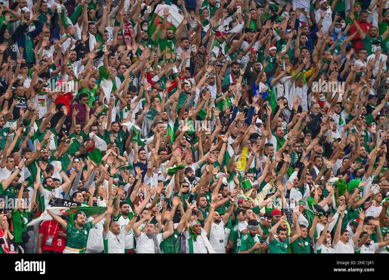 Doha, Qatar. 18th Dec, 2021. Supporters of Algeria cheer during the ...