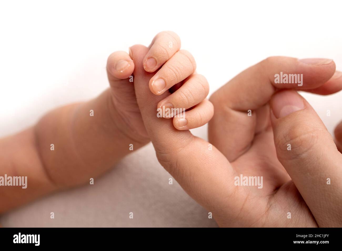 Infant grip hi-res stock photography and images - Alamy