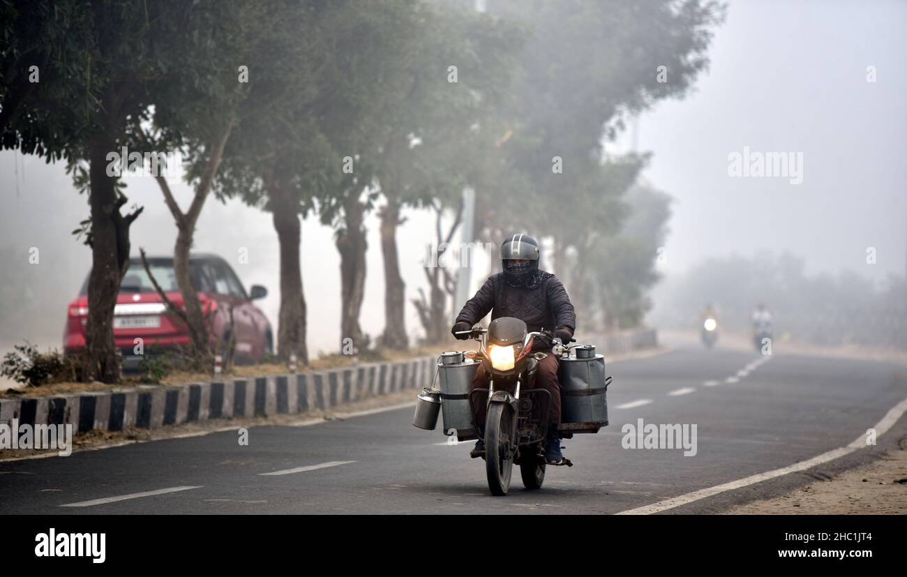 Indian milkman does his hi-res stock photography and images - Alamy