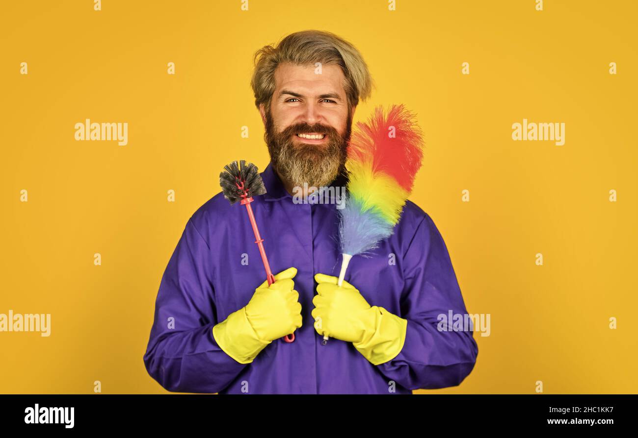 Cleaning apartment. Man use pp duster. Dust allergy. Husband cleaning ...