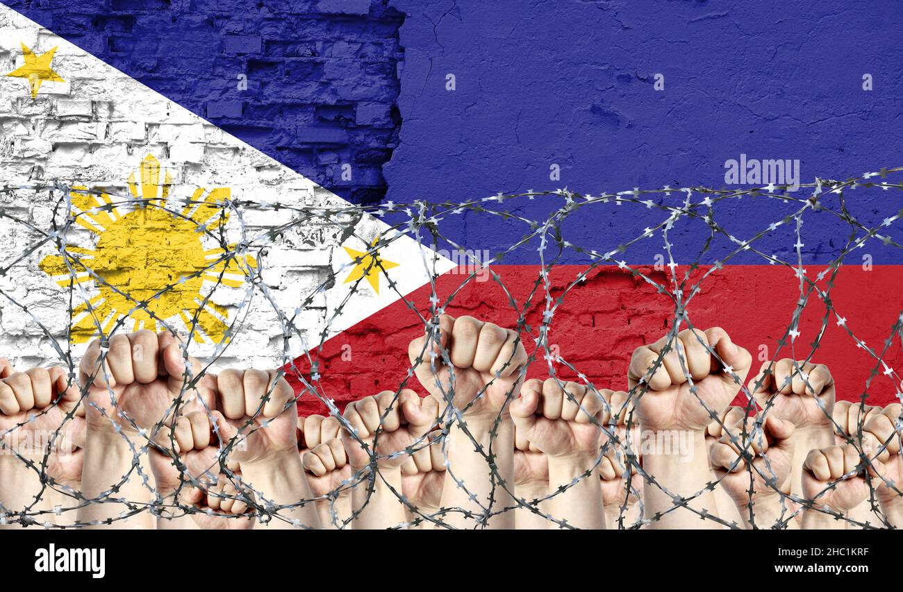 Barbed wire against the background of the inflicted flag of Philippines ...