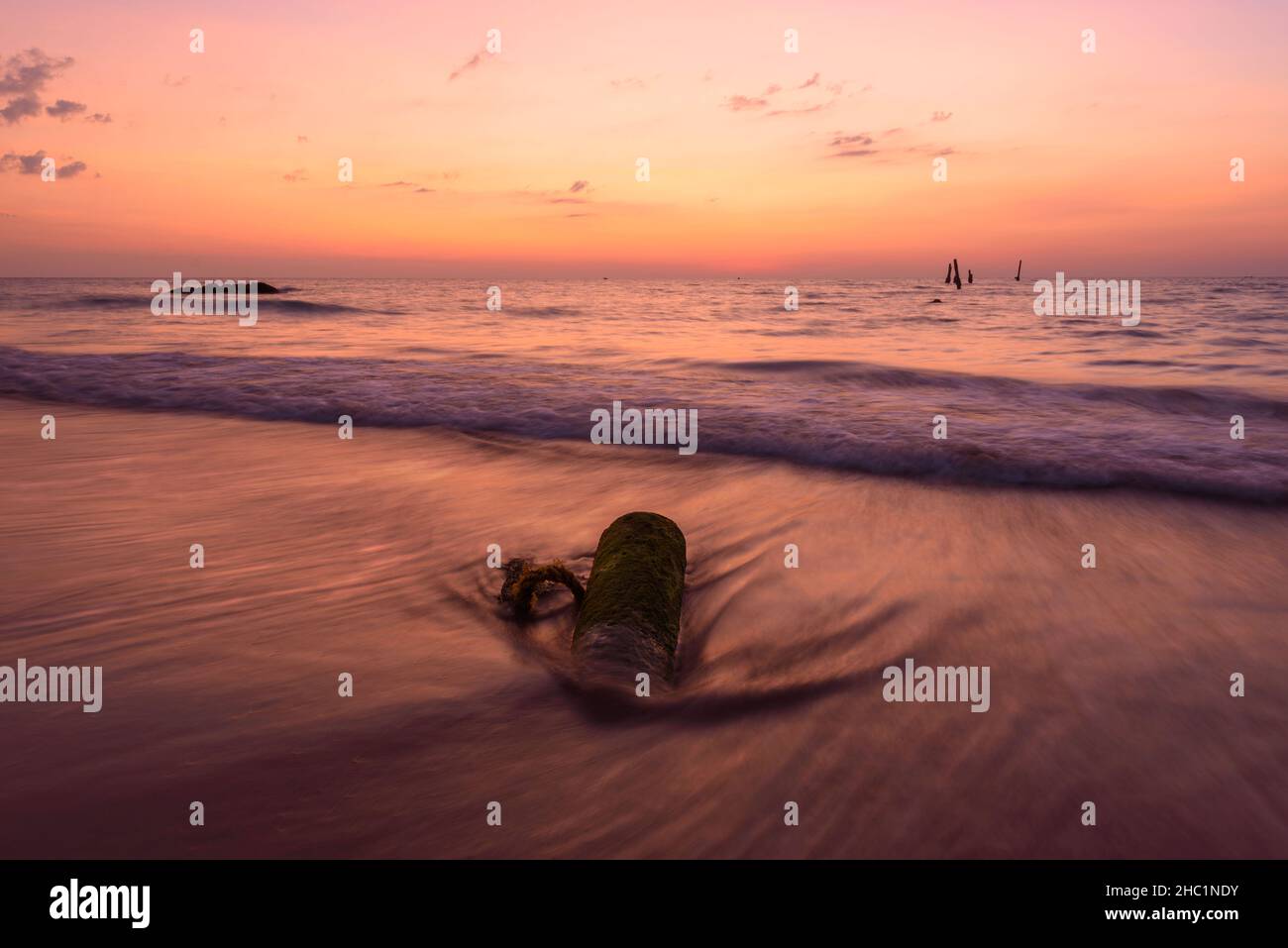 Old ruined wooden bridge and sunset sky at Pilai beach, Phang Nga ...