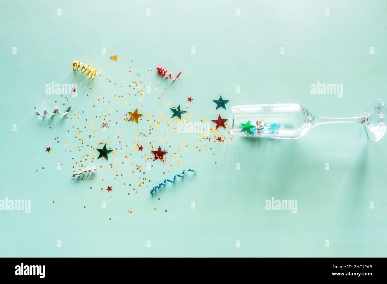 glass goblet and sparkles and confetti fireworks happy new year ...