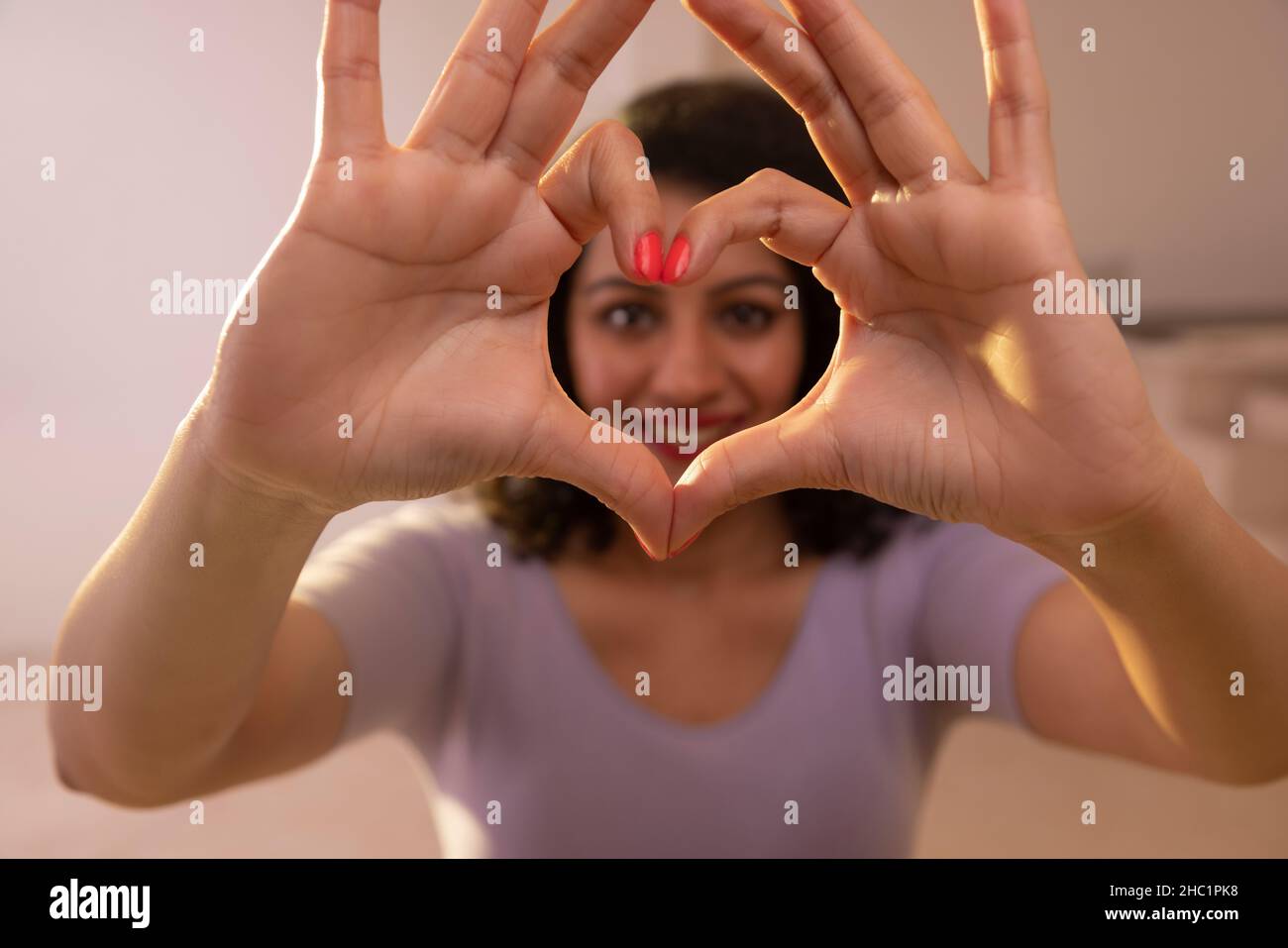 Lady making heart shape hi-res stock photography and images - Alamy