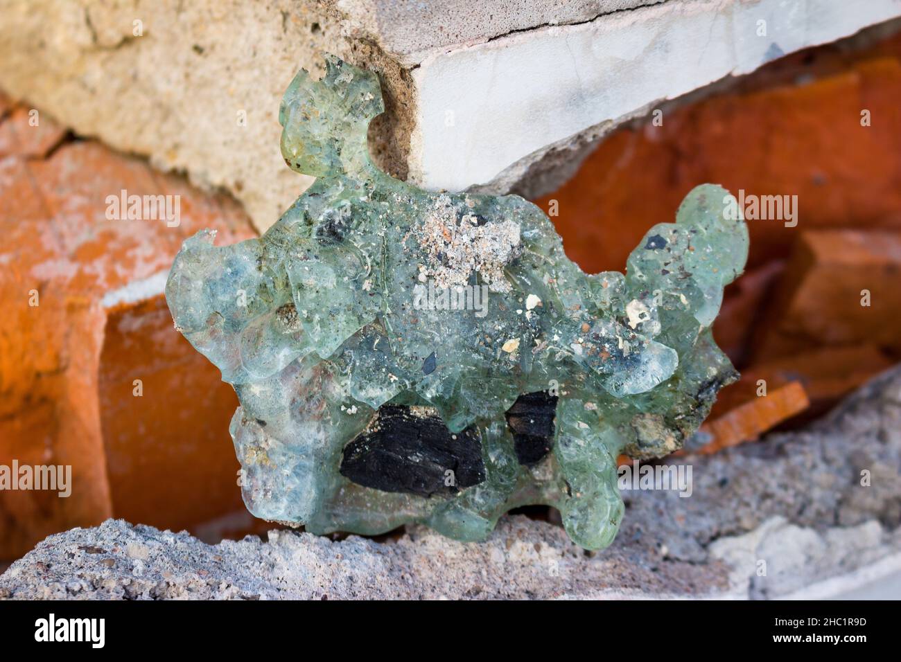Molten glass panes after a fire in a building Stock Photo - Alamy