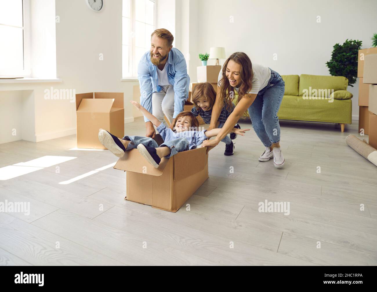 Husband and wife with children who have just moved into their own house ...