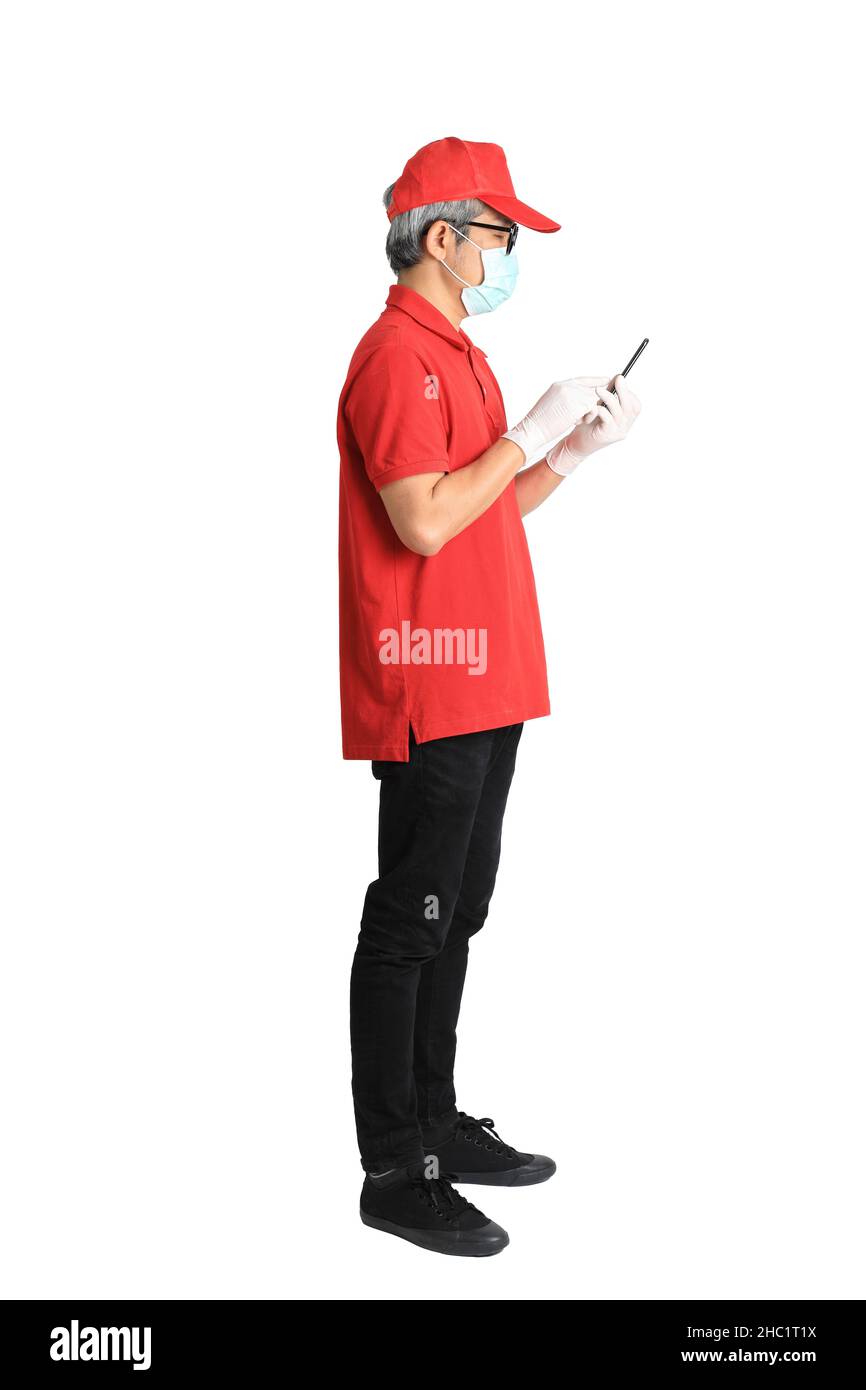The senior Asian postman with face mask on the white background Stock ...