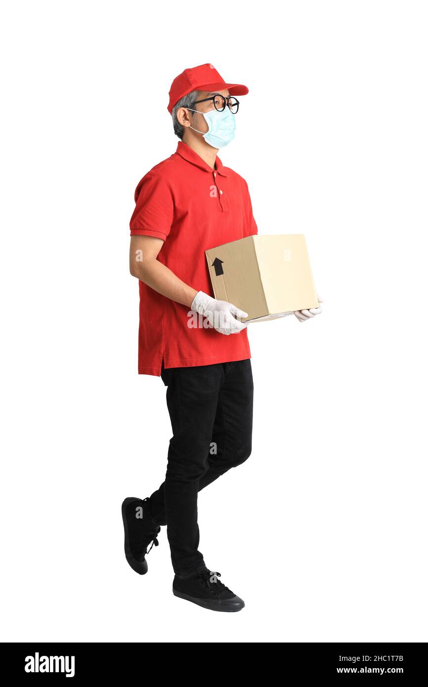 The senior Asian postman with face mask on the white background Stock ...