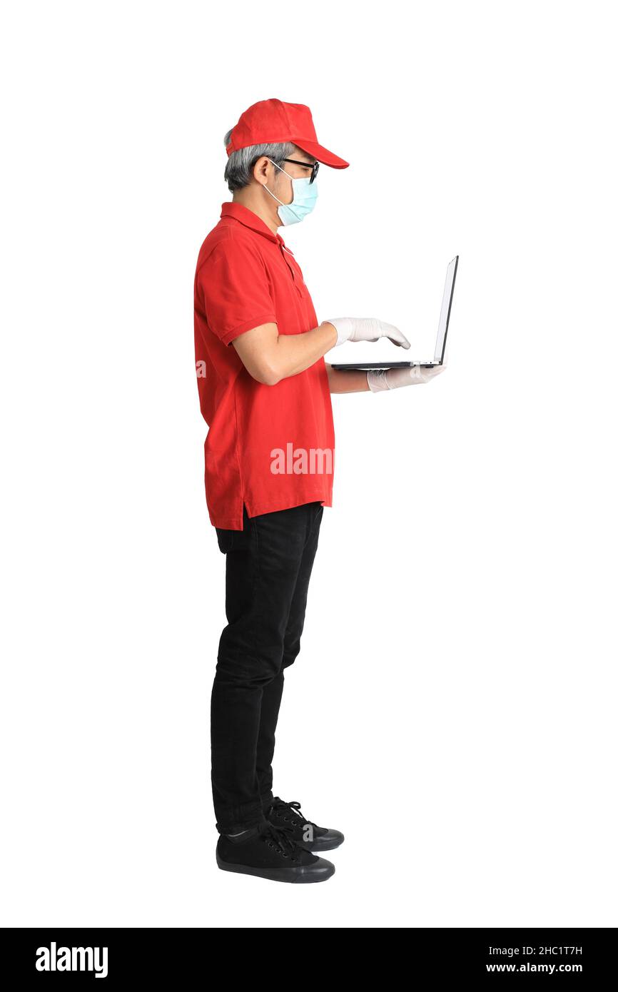 The senior Asian postman with face mask on the white background Stock ...
