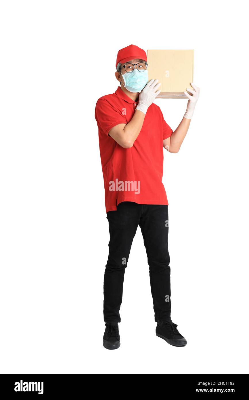 The senior Asian postman with face mask on the white background Stock ...