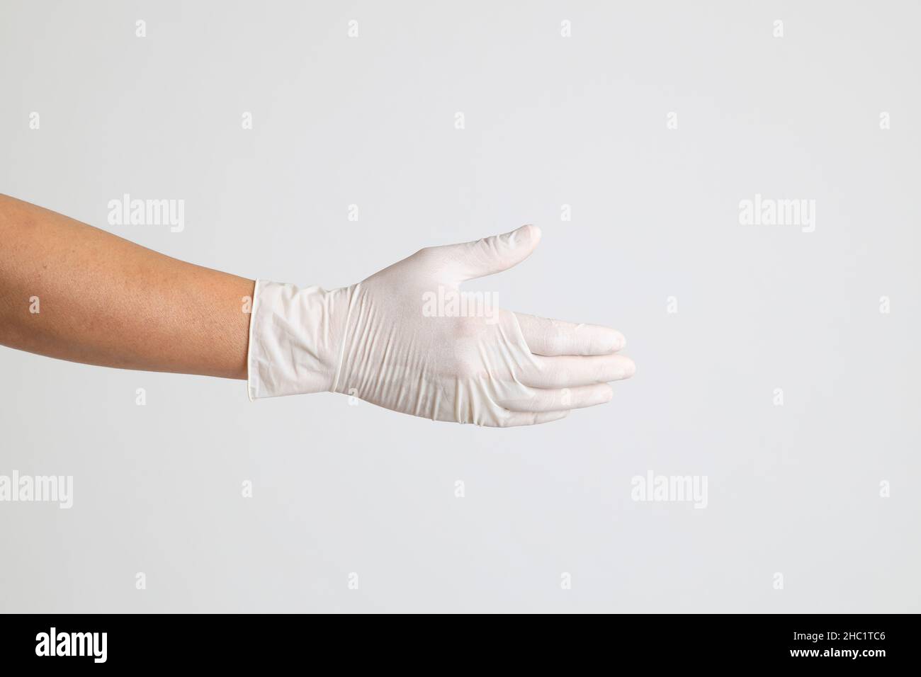 The human hand with glove on the white background Stock Photo - Alamy