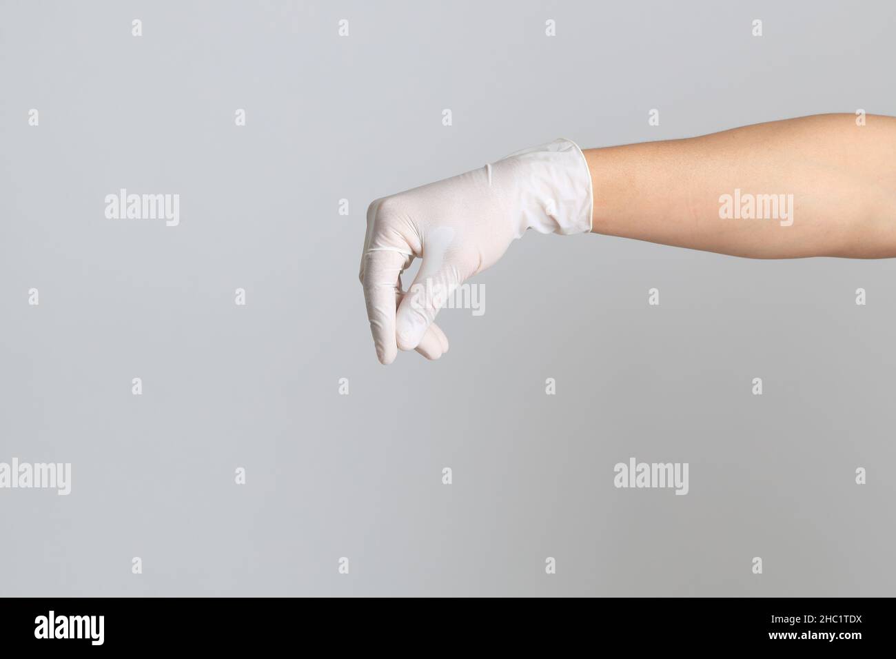 The human hand with glove on the white background Stock Photo - Alamy