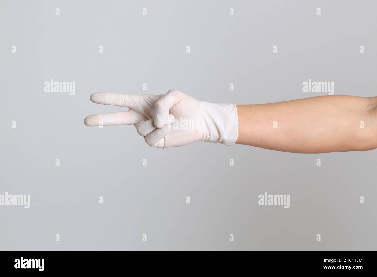 The human hand with glove on the white background Stock Photo - Alamy