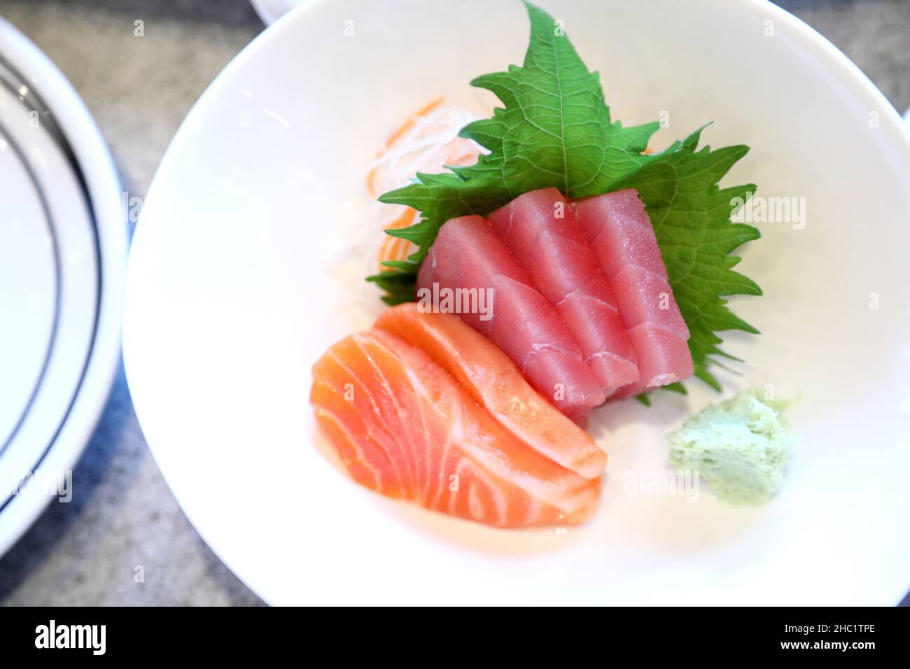 The Japanese dish named sashimi in the white bowl Stock Photo - Alamy