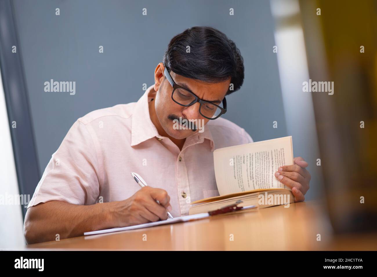 Indian man reading board hi-res stock photography and images - Alamy