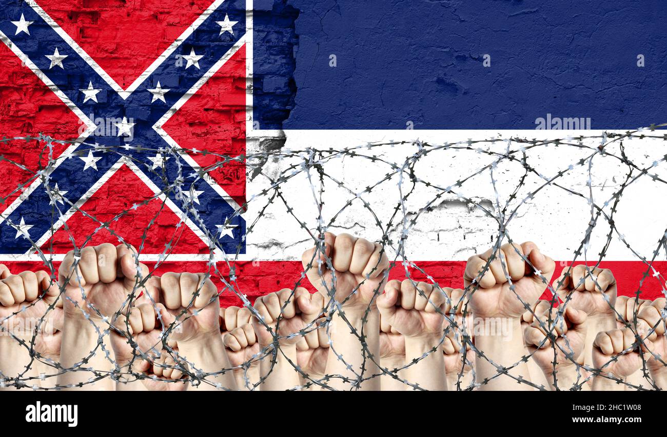 Barbed wire against the background of the inflicted flag of State of ...