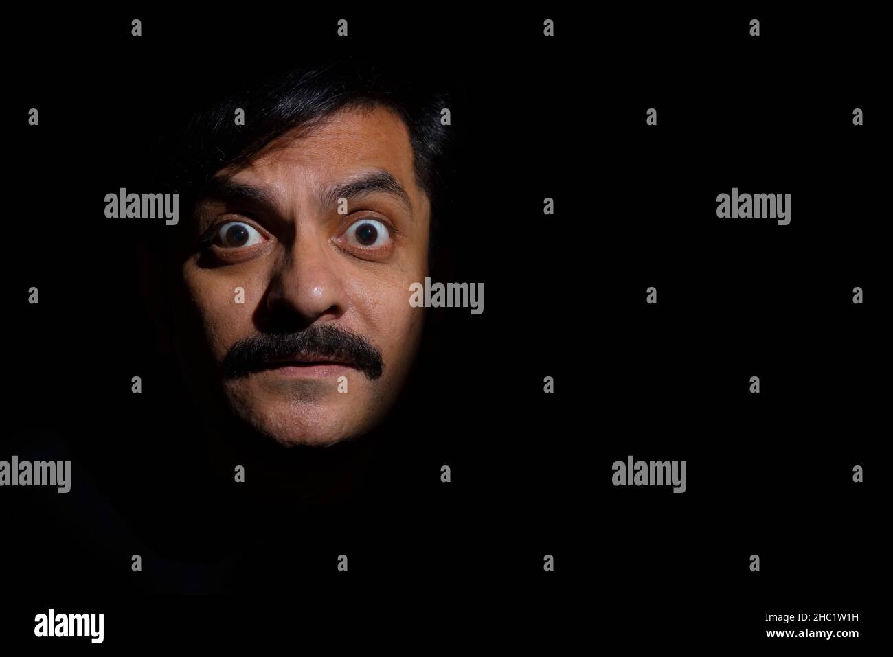 Close-up Portrait of a common man with black background Stock Photo - Alamy