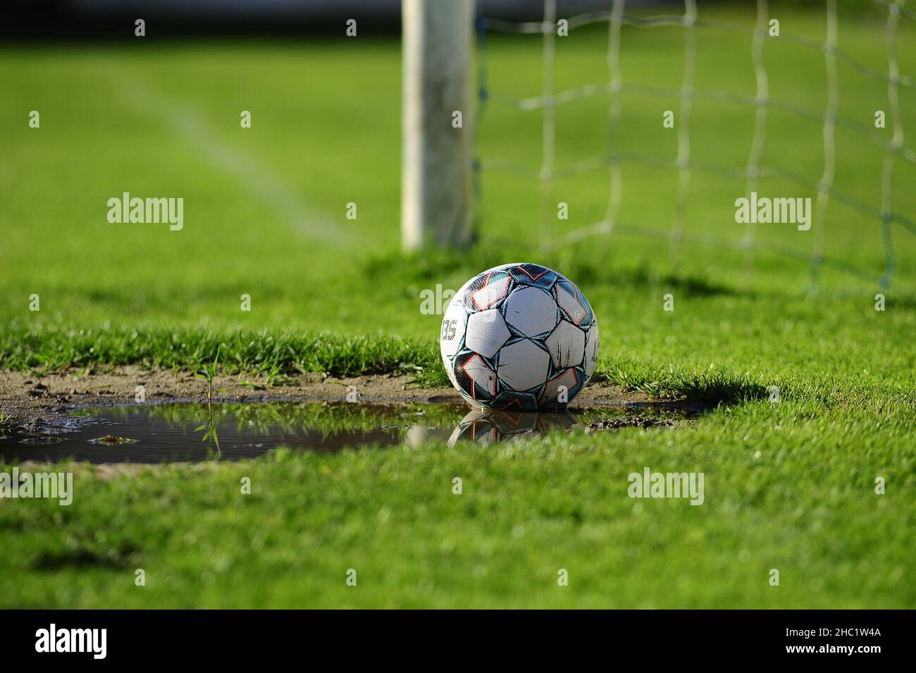 Football in mud hi-res stock photography and images - Alamy