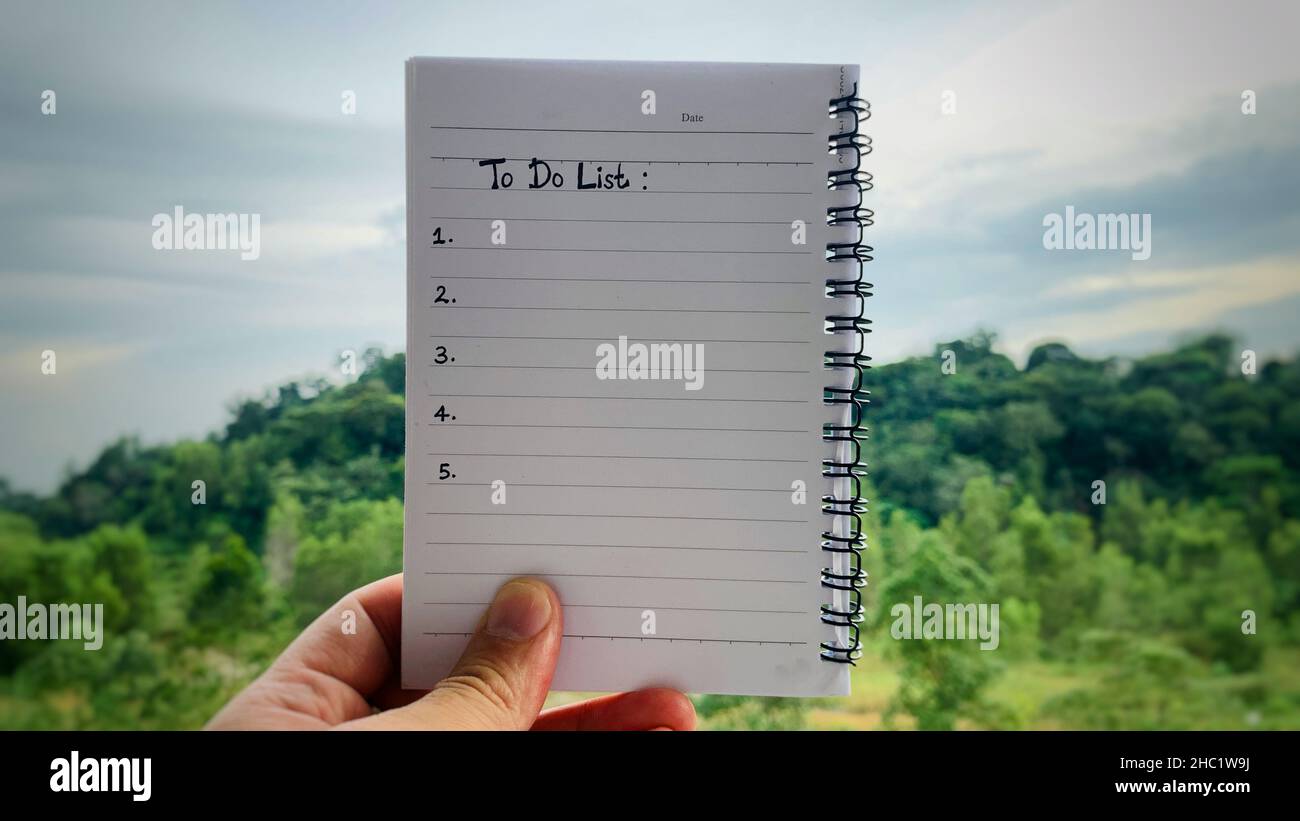 Image with to do list text written on a note pad with beautiful blurred ...