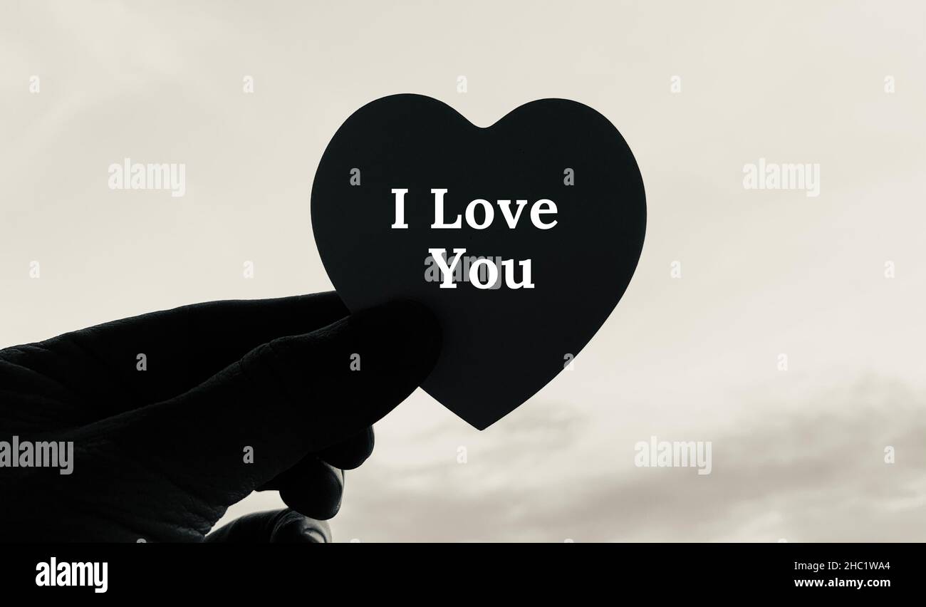 Image with text saying I love you on a heart shape cardboard Stock ...