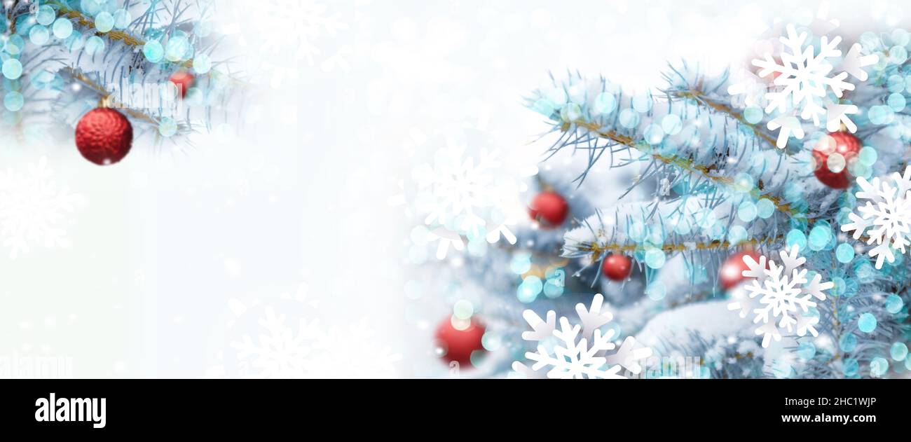 Blue Christmas tree background with shiny blurred light, red xmas balls ...