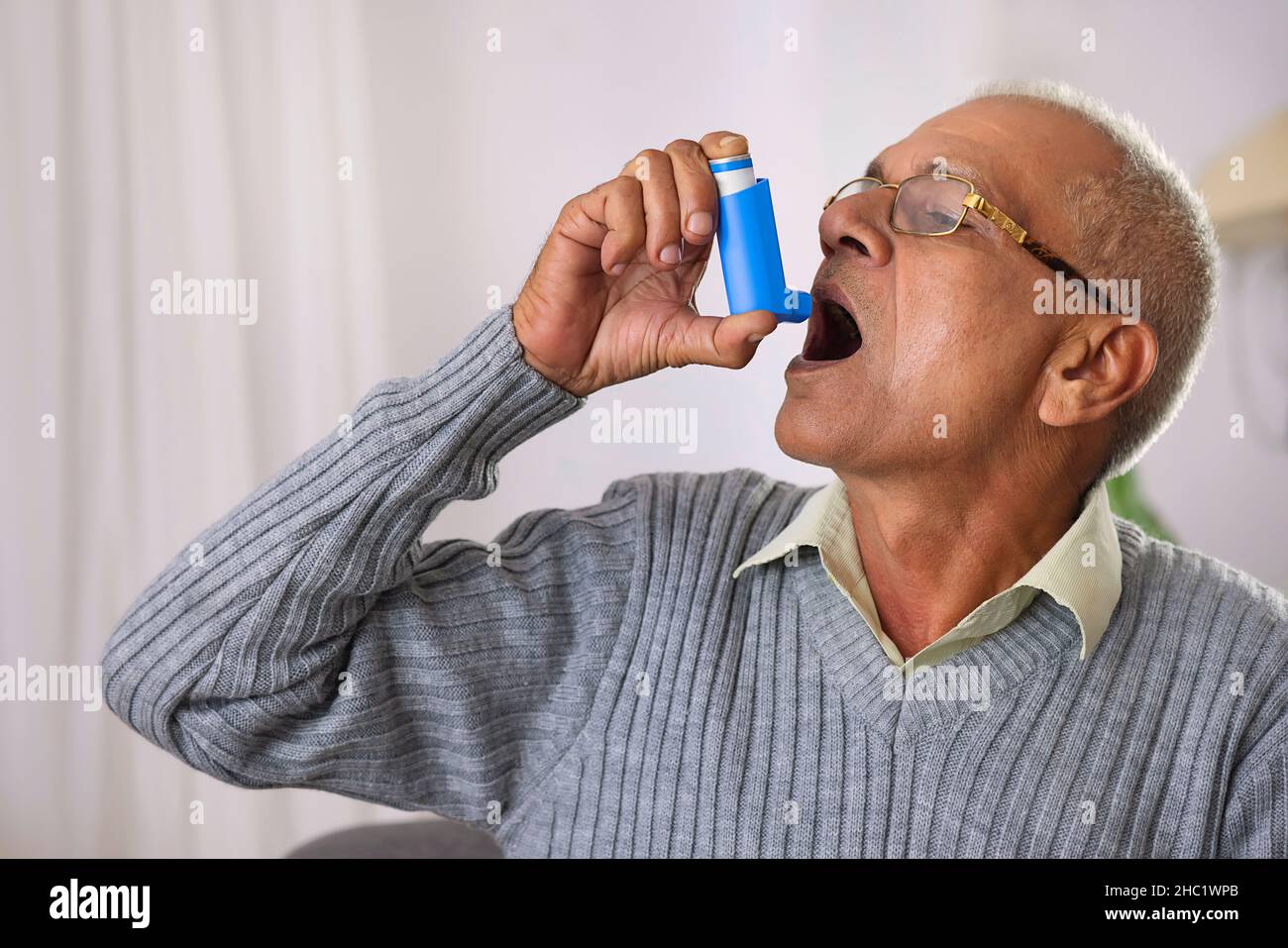 Elderly asian man with inhaler hi-res stock photography and images - Alamy