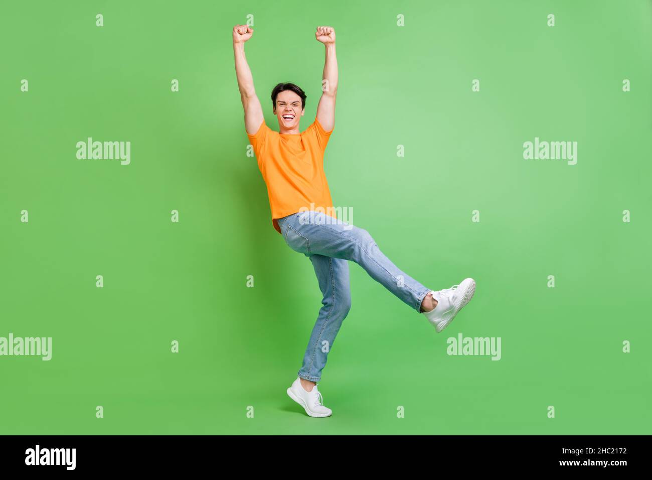 Full body photo of cheerful triumphant luck man raise hands winner ...