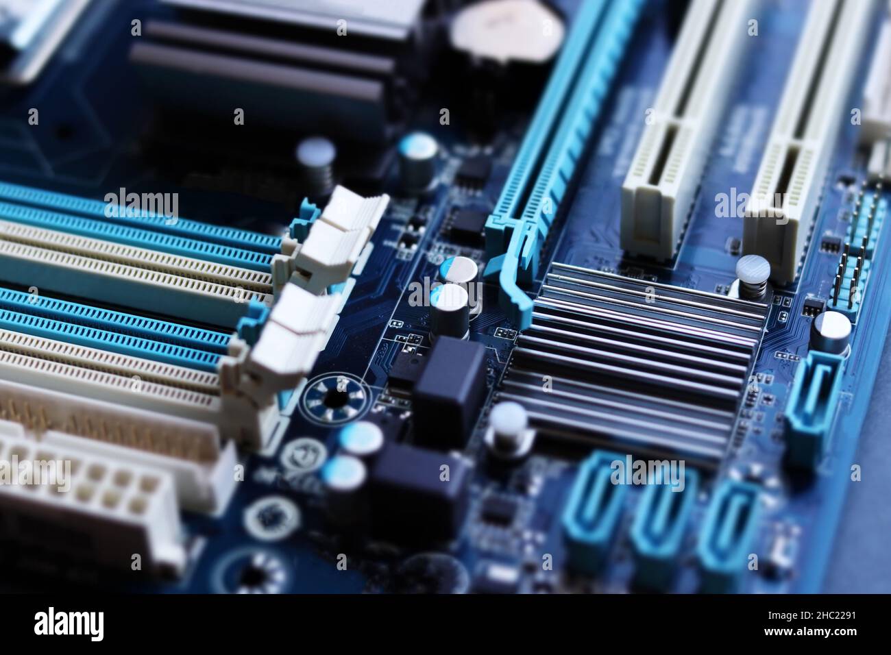 Computer motherboard closeup in tilt shift style. Computer equipment ...