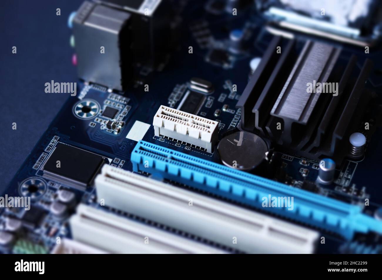 Computer motherboard closeup in tilt shift style. Computer equipment ...