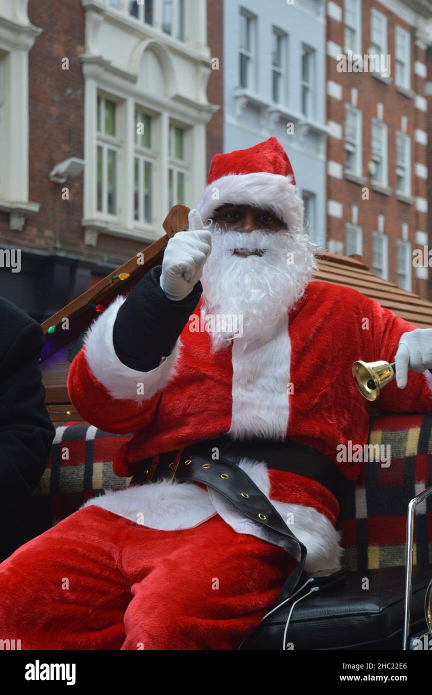 London, UK. December 18, 2021: A man seen in a Santa Claus outfit in ...