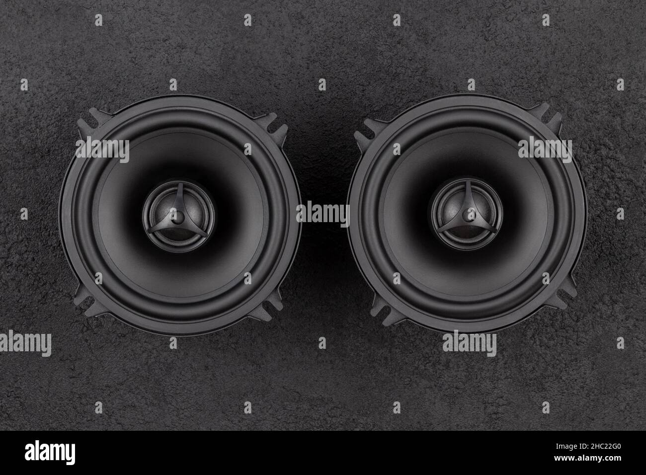 Stylish car audio acoustic round speakers on dark black background ...