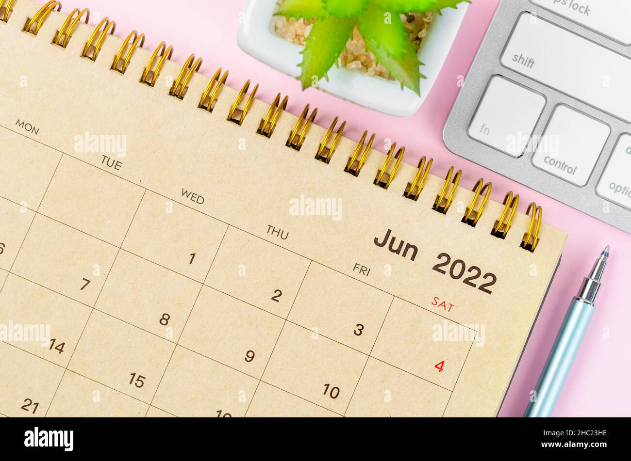 June 2021 desk calendar with keyboard computer on pink background Stock ...