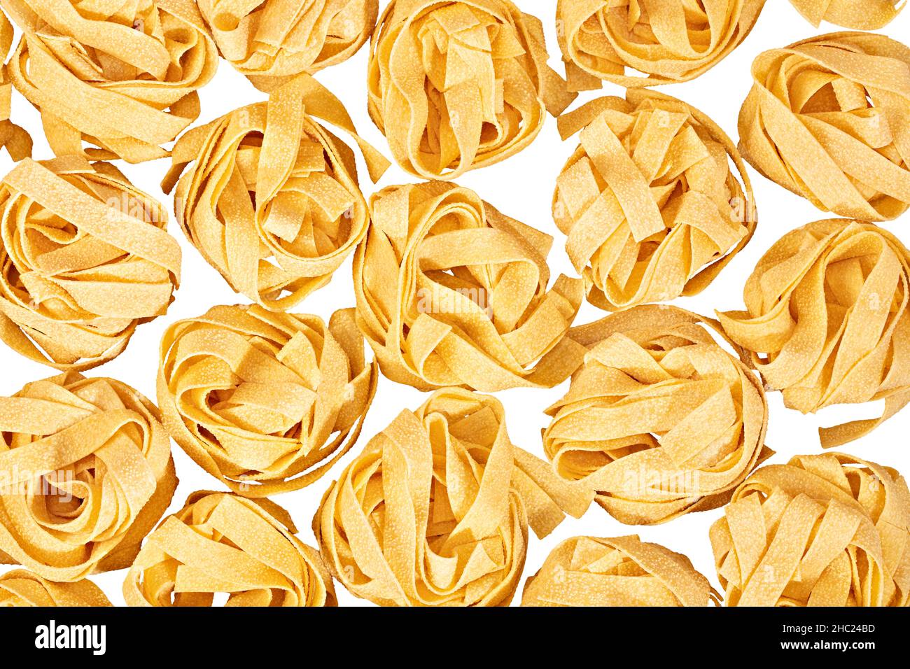 Uncooked tagliatelle nests pasta Stock Photo - Alamy