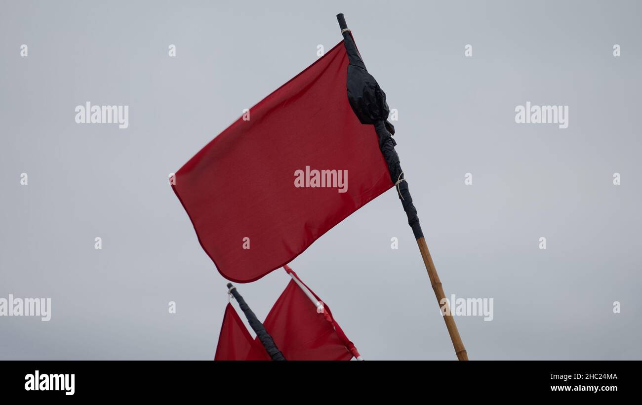 Red flags on bamboo pole hi-res stock photography and images - Alamy