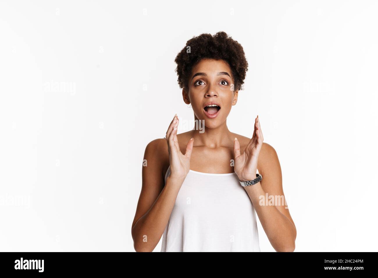 Young Black Woman In Tank Top Expressing Surprise At Camera Isolated