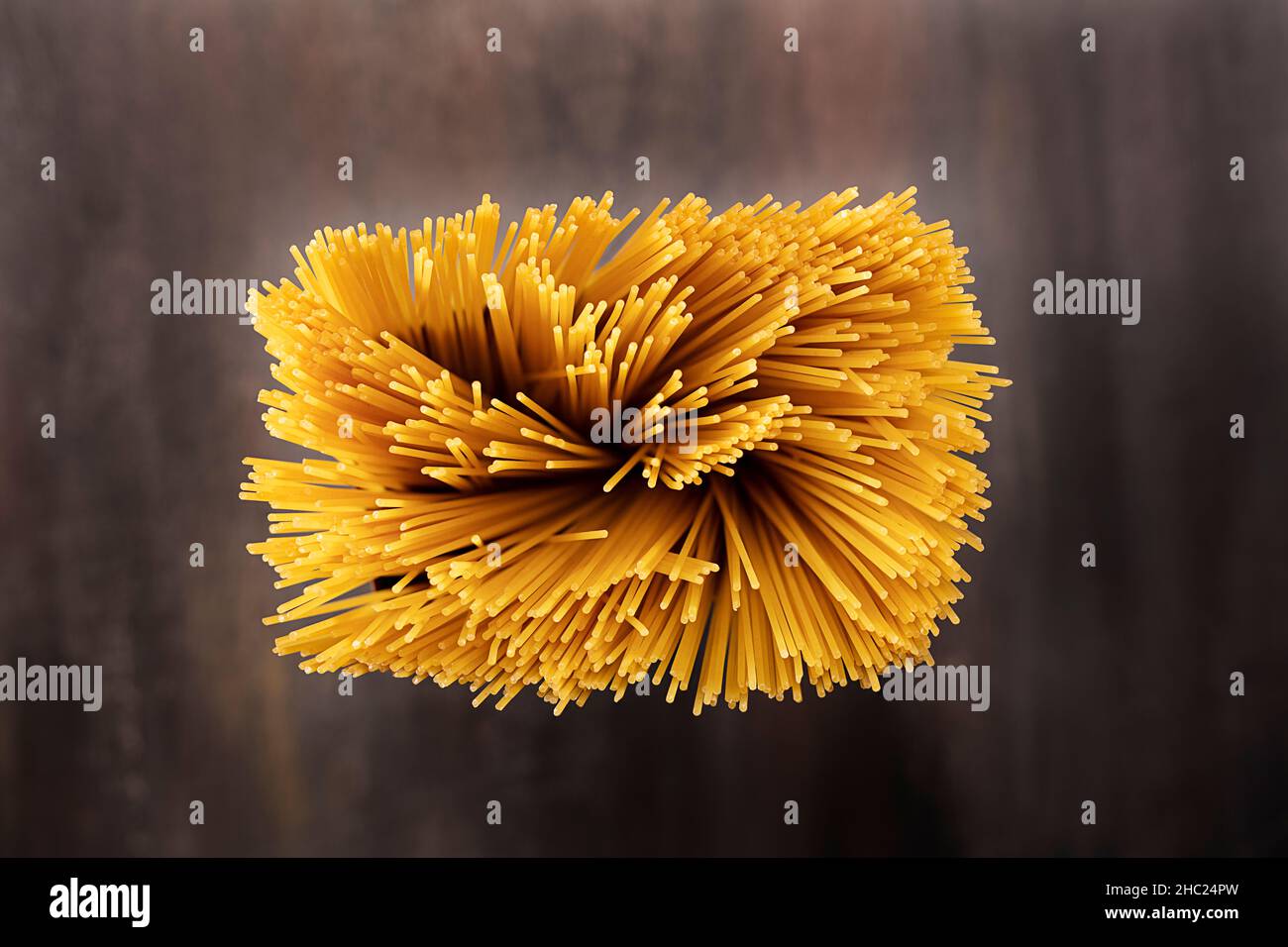 Uncooked spaghetti, top view shooting on rustic wood Stock Photo - Alamy