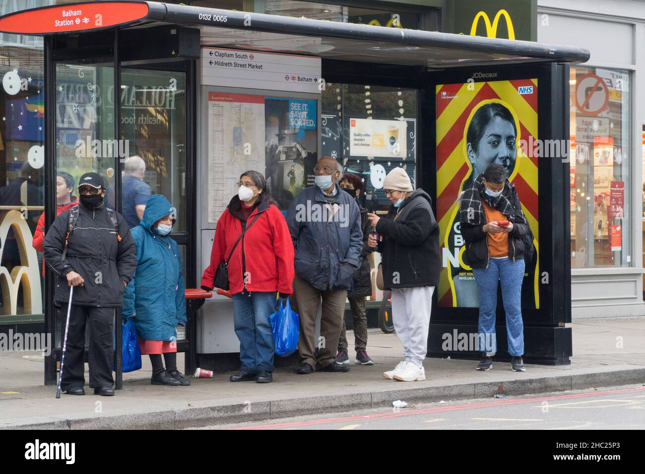 Bus stop queue with face masks hi-res stock photography and images - Alamy