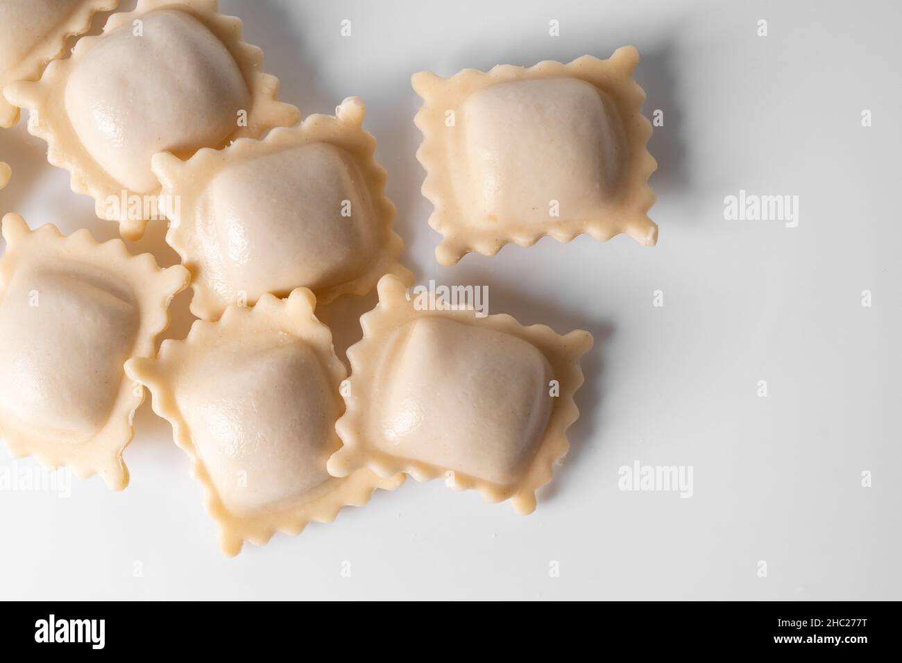 Ravioli pasta squares on a light background Stock Photo - Alamy