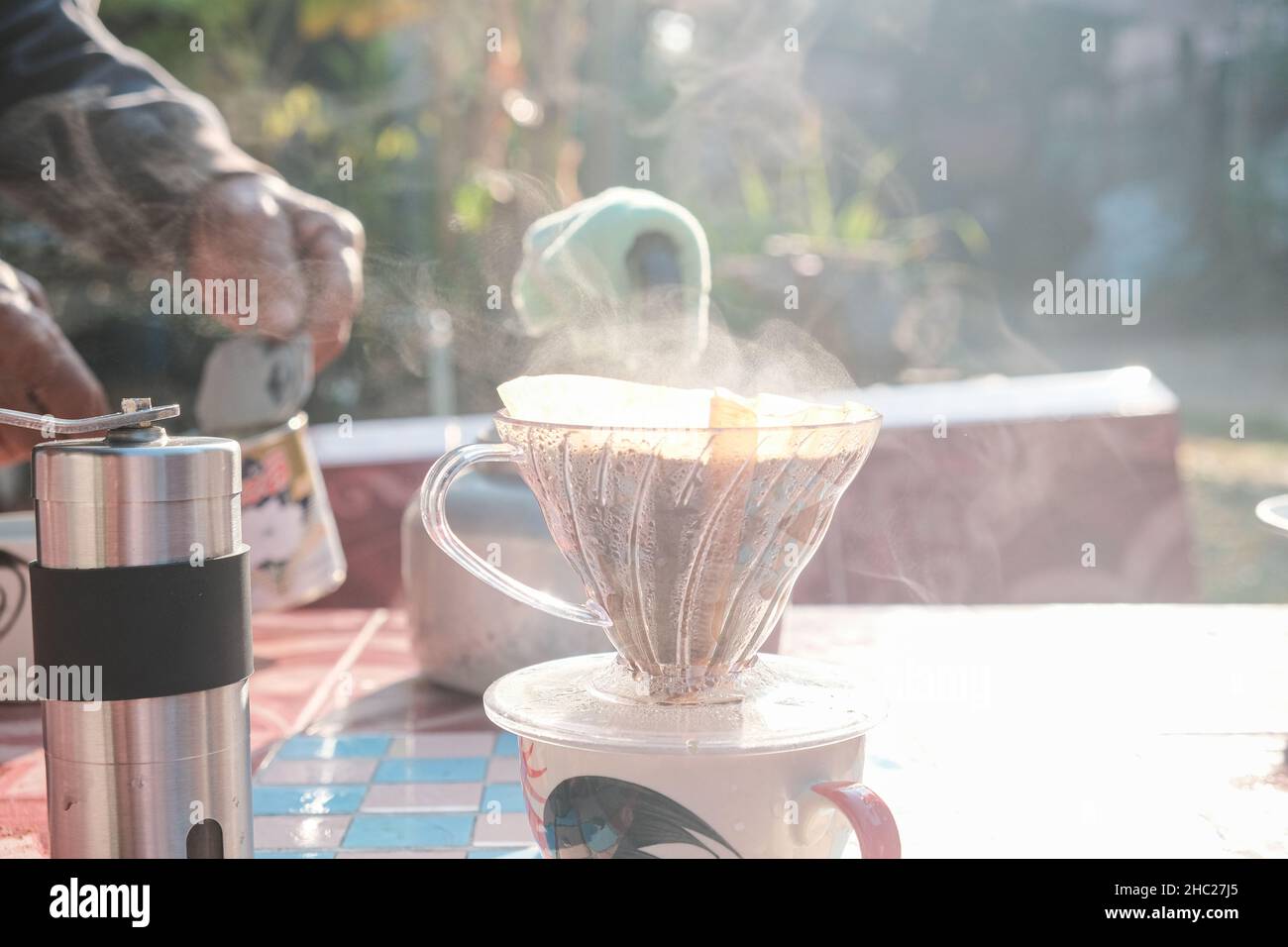 Coffee drip and smoke with group of people friend hand grind coffee in ...