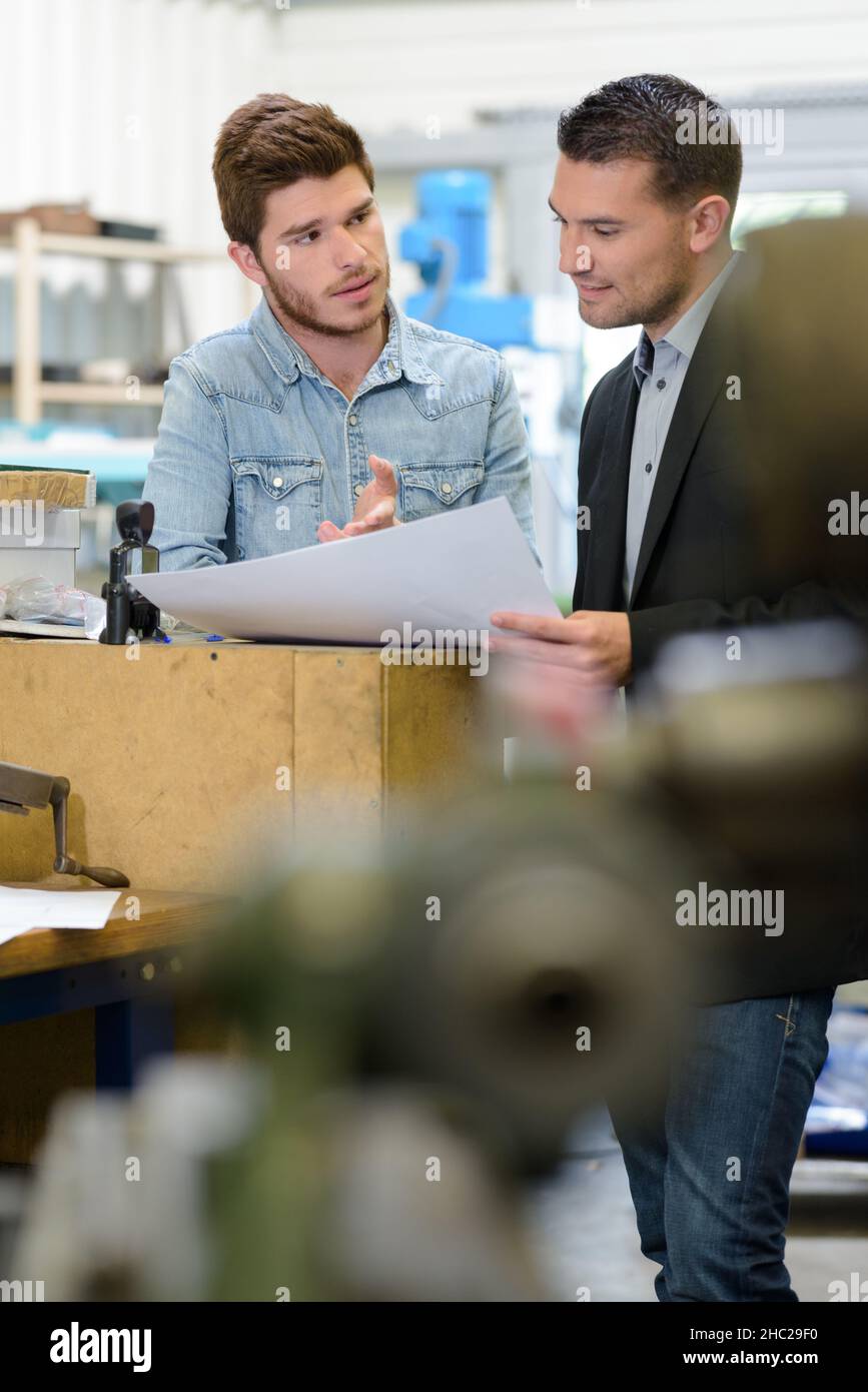 Two men assist hi-res stock photography and images - Alamy