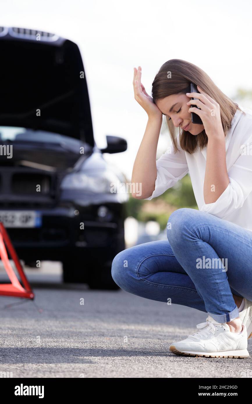 emergency stop sign and driver near broken car on road Stock Photo - Alamy