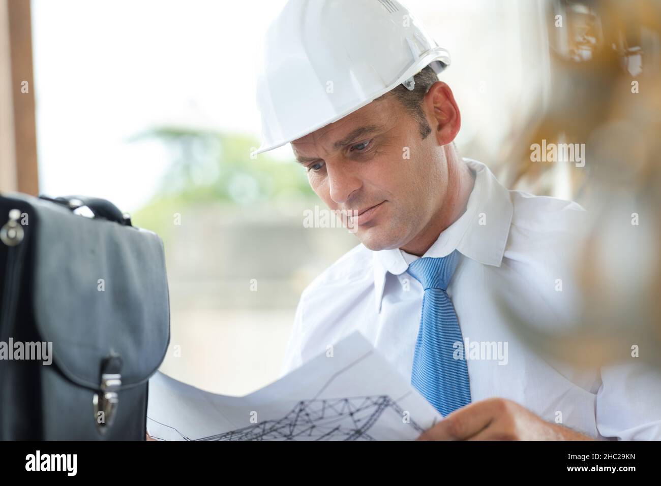 Architect looking drawings in office hi-res stock photography and ...