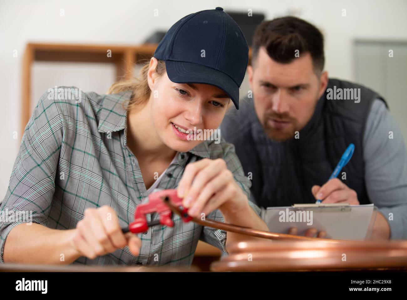 Female plumber pipe cut hi-res stock photography and images - Alamy