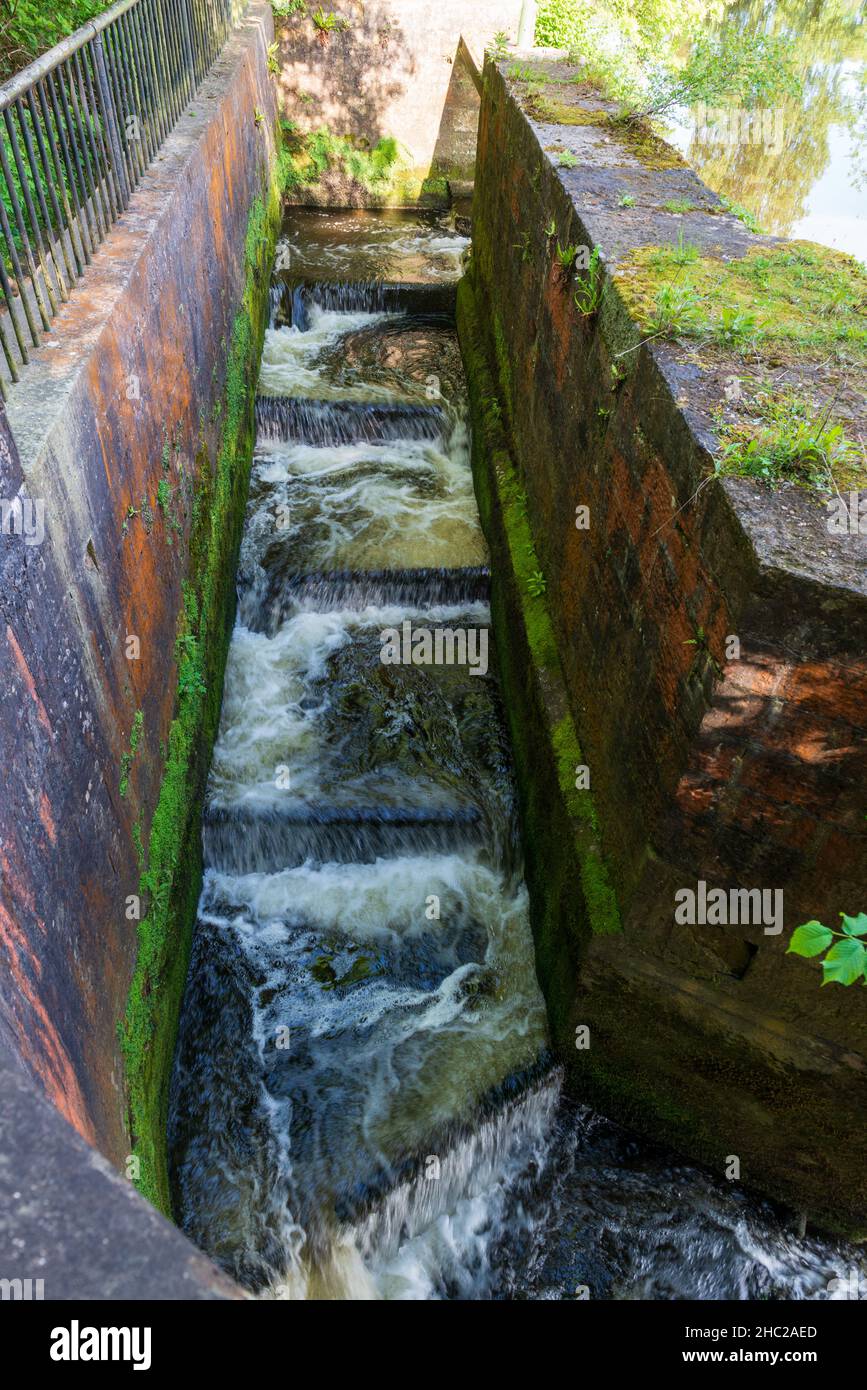 A narrow fish pass next to the River Wharfe weir in Wetherby, West ...