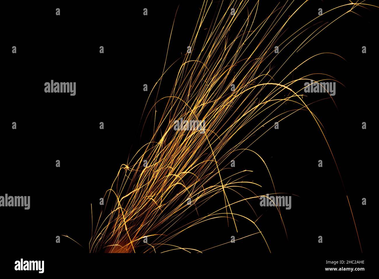 Red sparks on a black background Stock Photo - Alamy