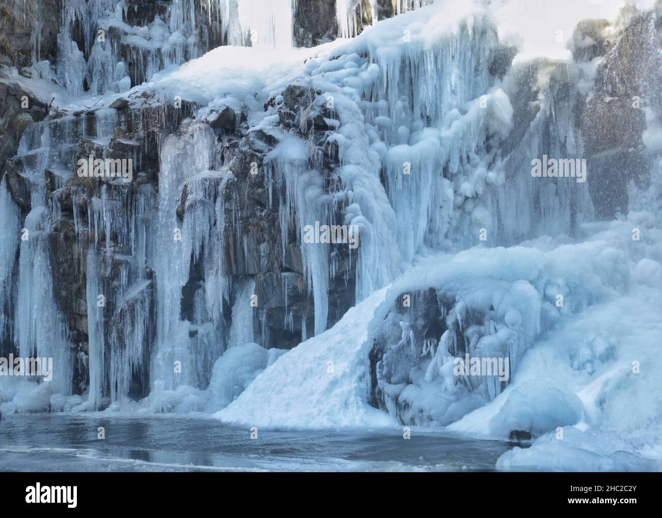 A view of a frozen waterfall at Drung region of Tangmarg, in Srinagar ...